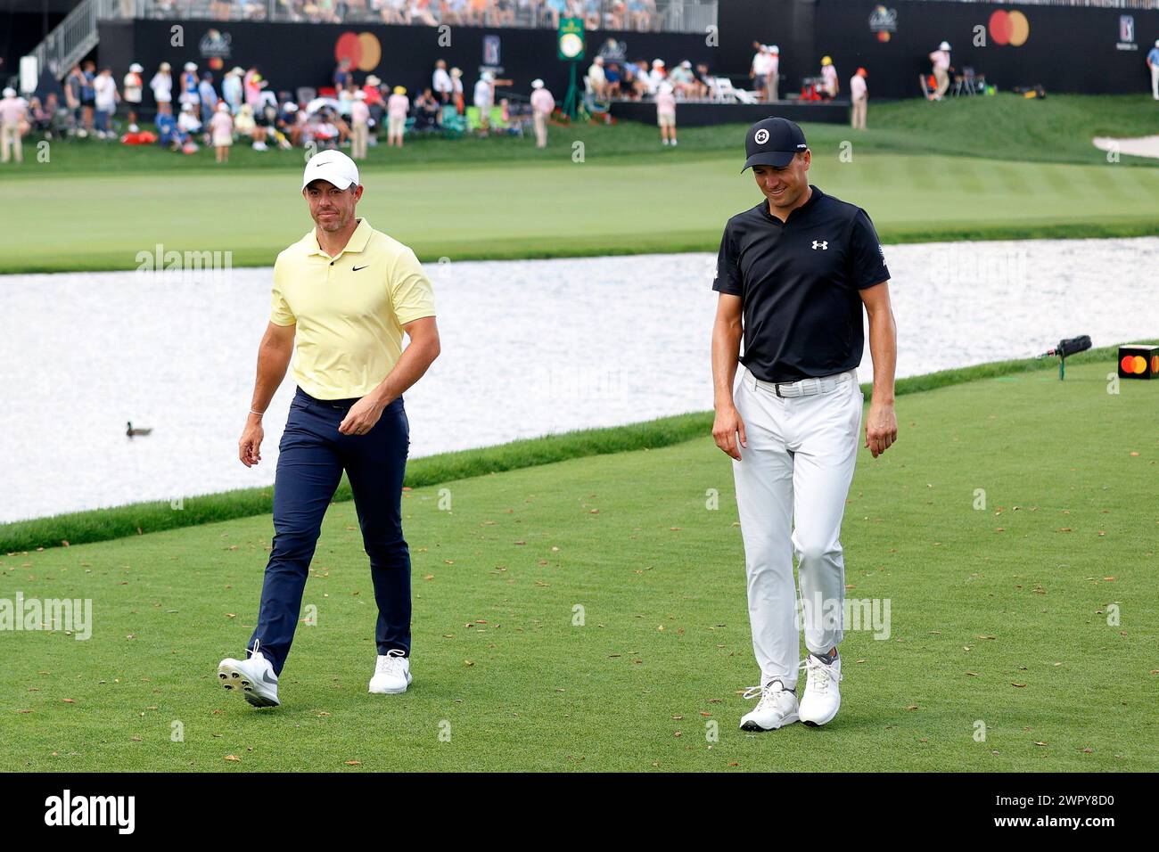 ORLANDO, FL - MARCH 09: PGA golfer Rory McIlroy in yellow shirt talks ...