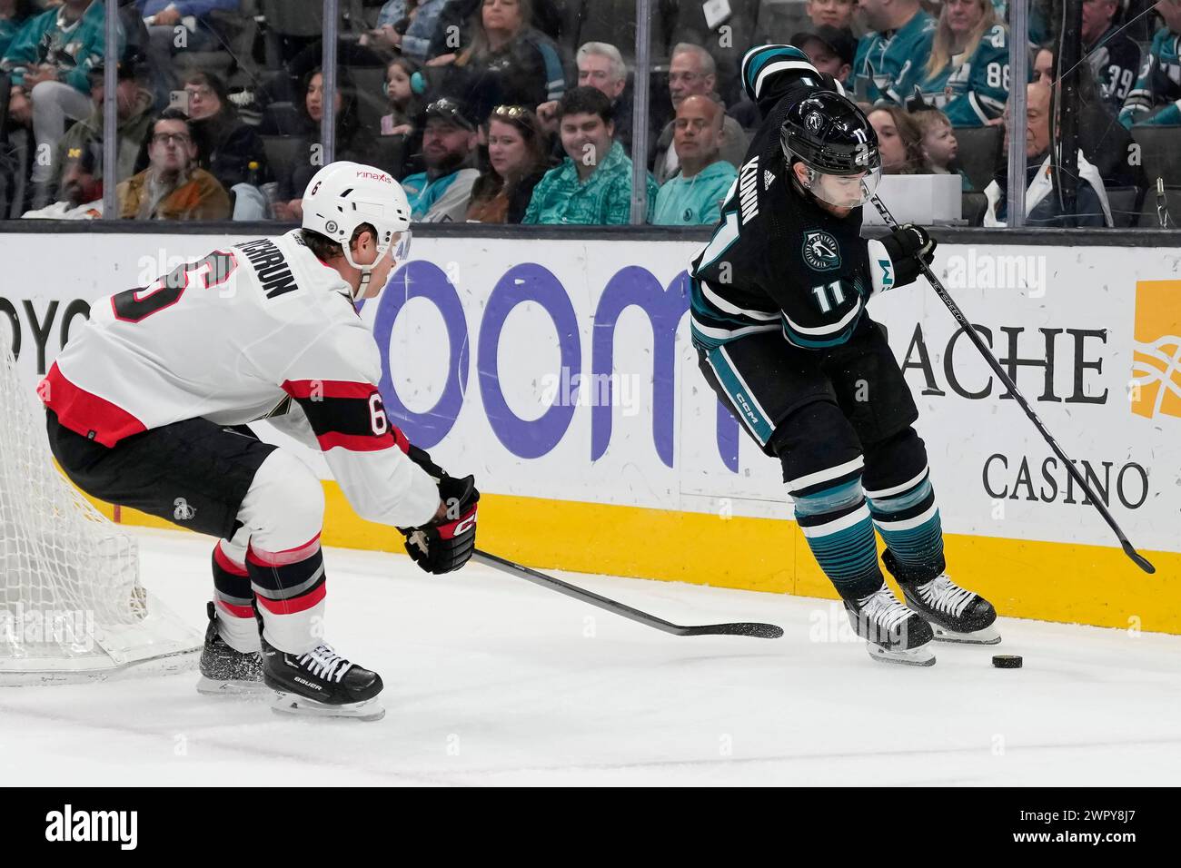 San Jose Sharks center Luke Kunin (11) skates toward the puck against ...