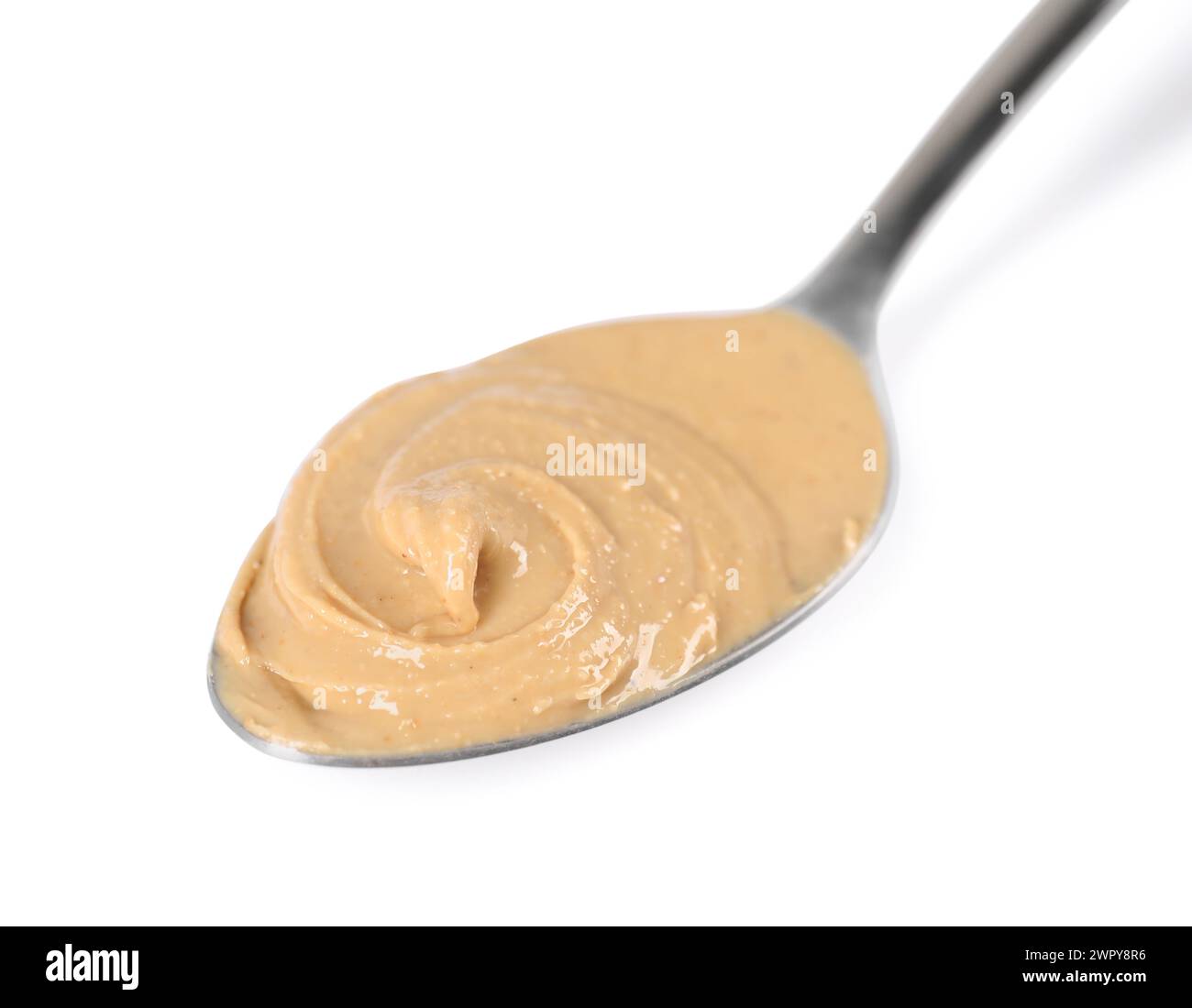 Delicious nut butter in spoon isolated on white Stock Photo - Alamy