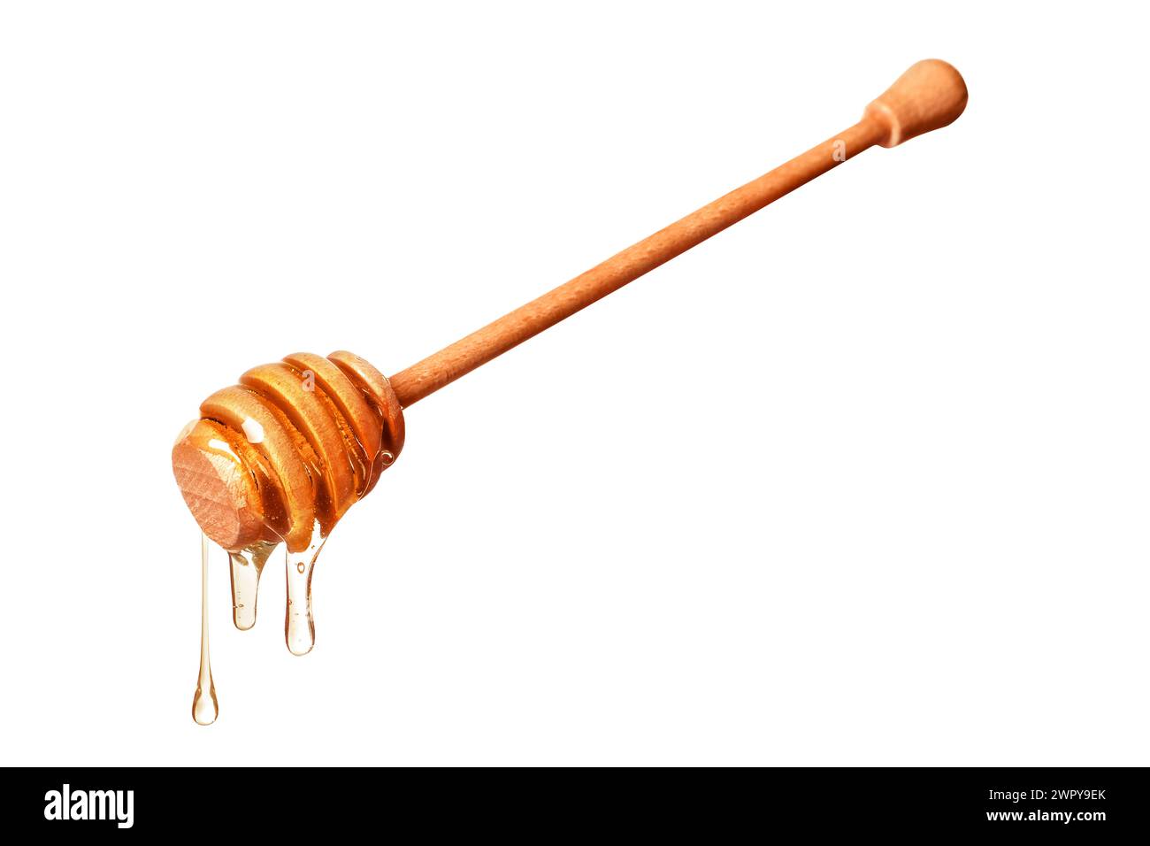 Natural honey dripping from dipper on white background Stock Photo - Alamy