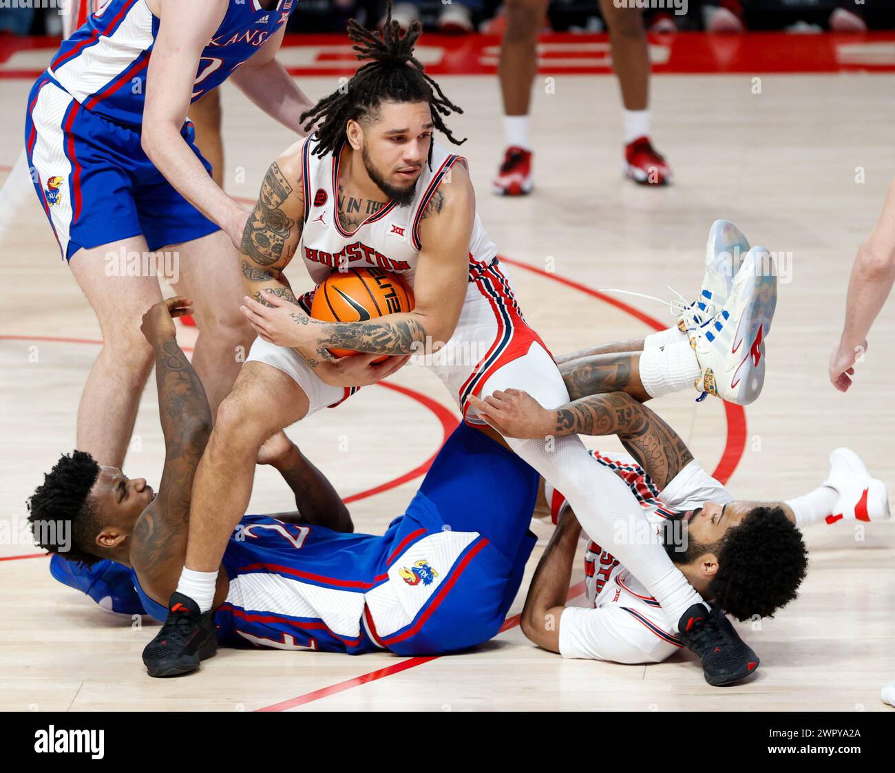 March 9, 2024: Houston guard Emanuel Sharp (21) wins the ball in a ...