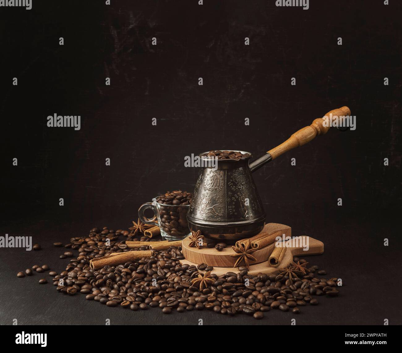 Roasted coffee beans, spices and turk (cezve). Turkish coffee with ...