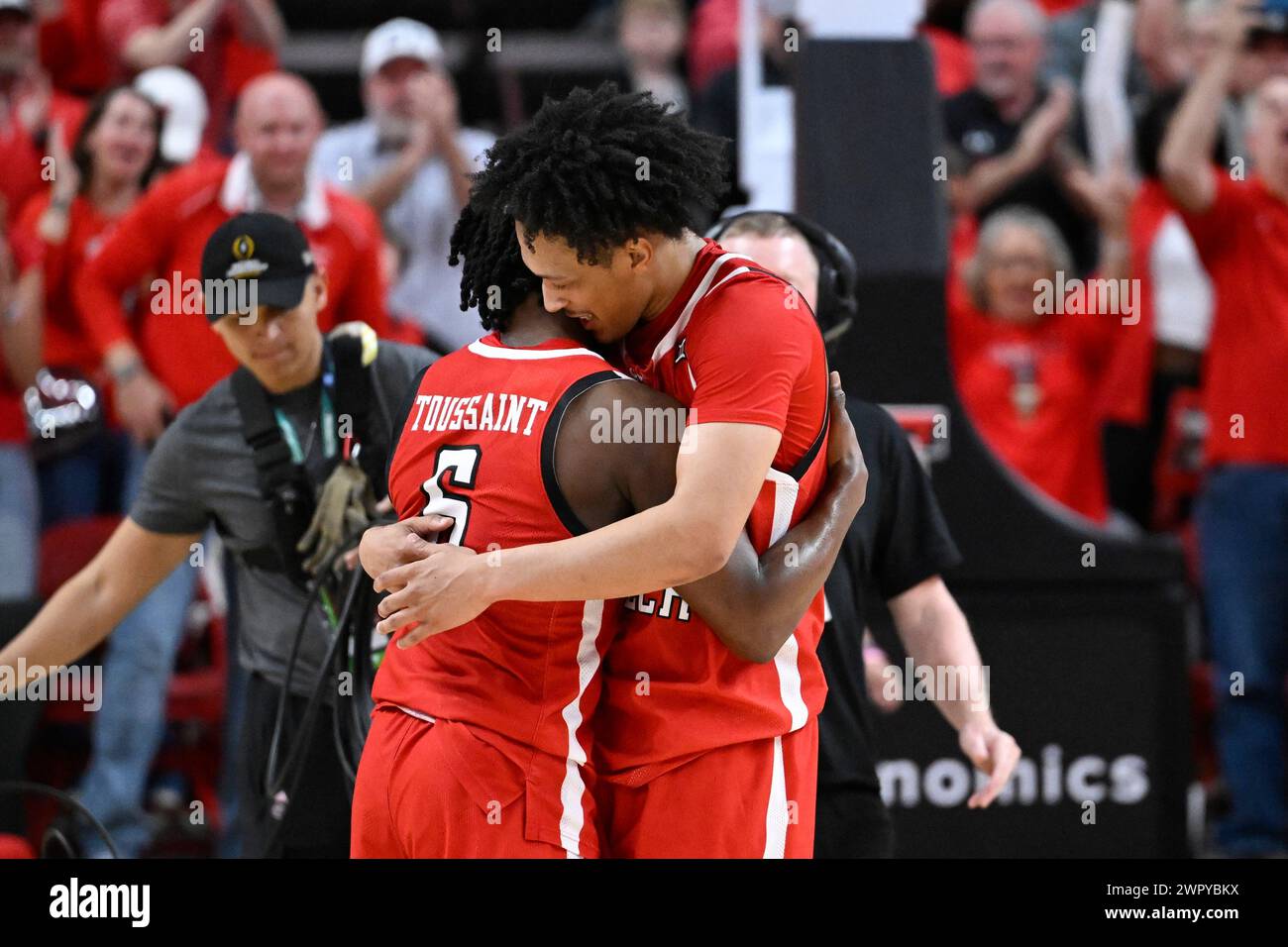 Texas Tech guard Joe Toussaint, left, and guard Darrion Williams hug ...