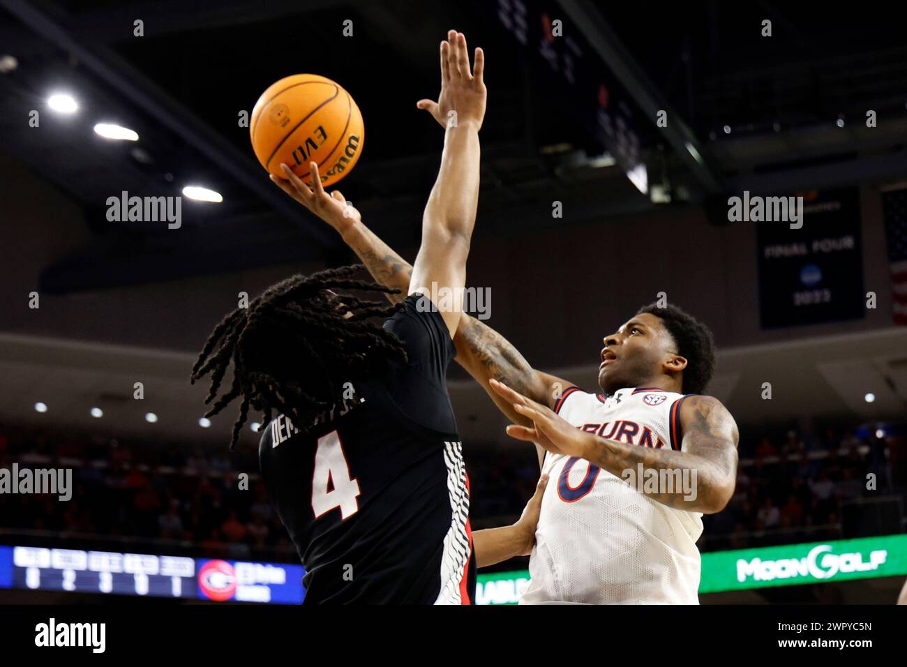 Auburn guard K.D. Johnson (0) scores on a layup as Georgia guard Silas ...