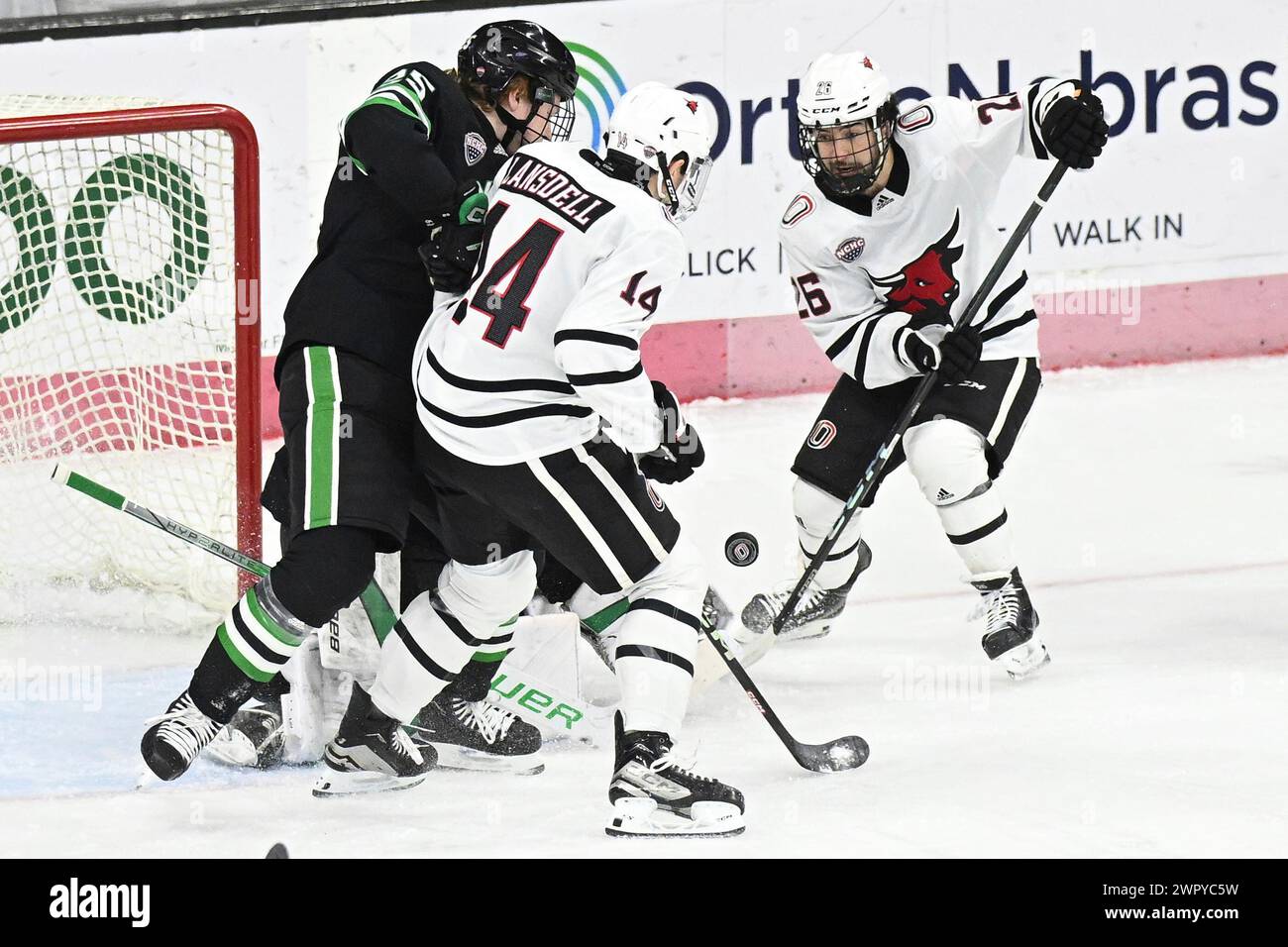 Omaha Mavericks forward Brock Bremer (26) attempts to get a shot past ...