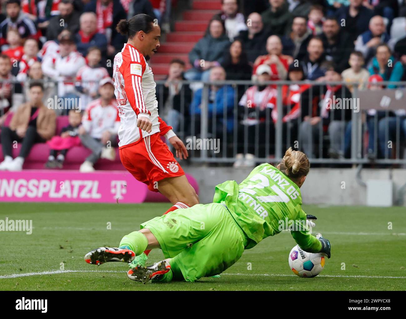 Munich, Germany. 9th Mar, 2024. Leroy Sane (L) of Bayern Munich vies with Mainz's goalkeeper ...