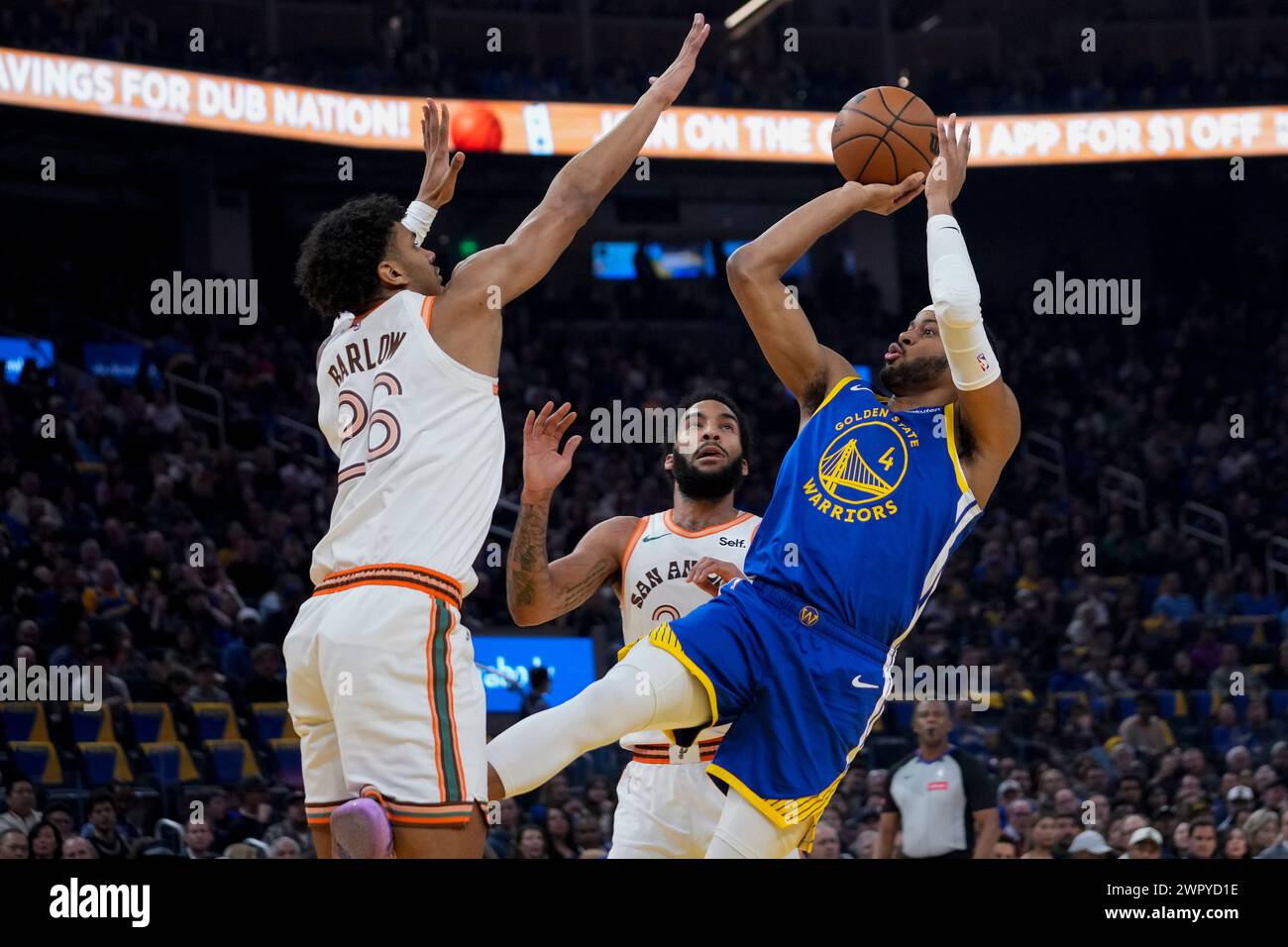 Golden State Warriors guard Moses Moody (4) shoots while defended by ...