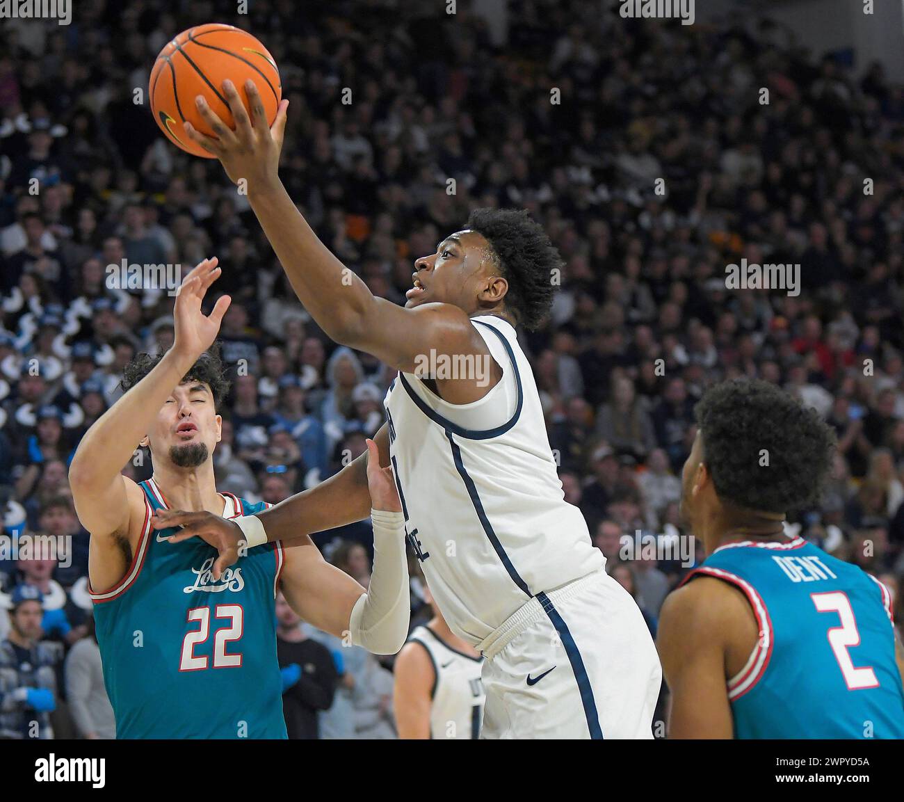 Utah State forward Great Osobor shoots as New Mexico forward Mustapha ...