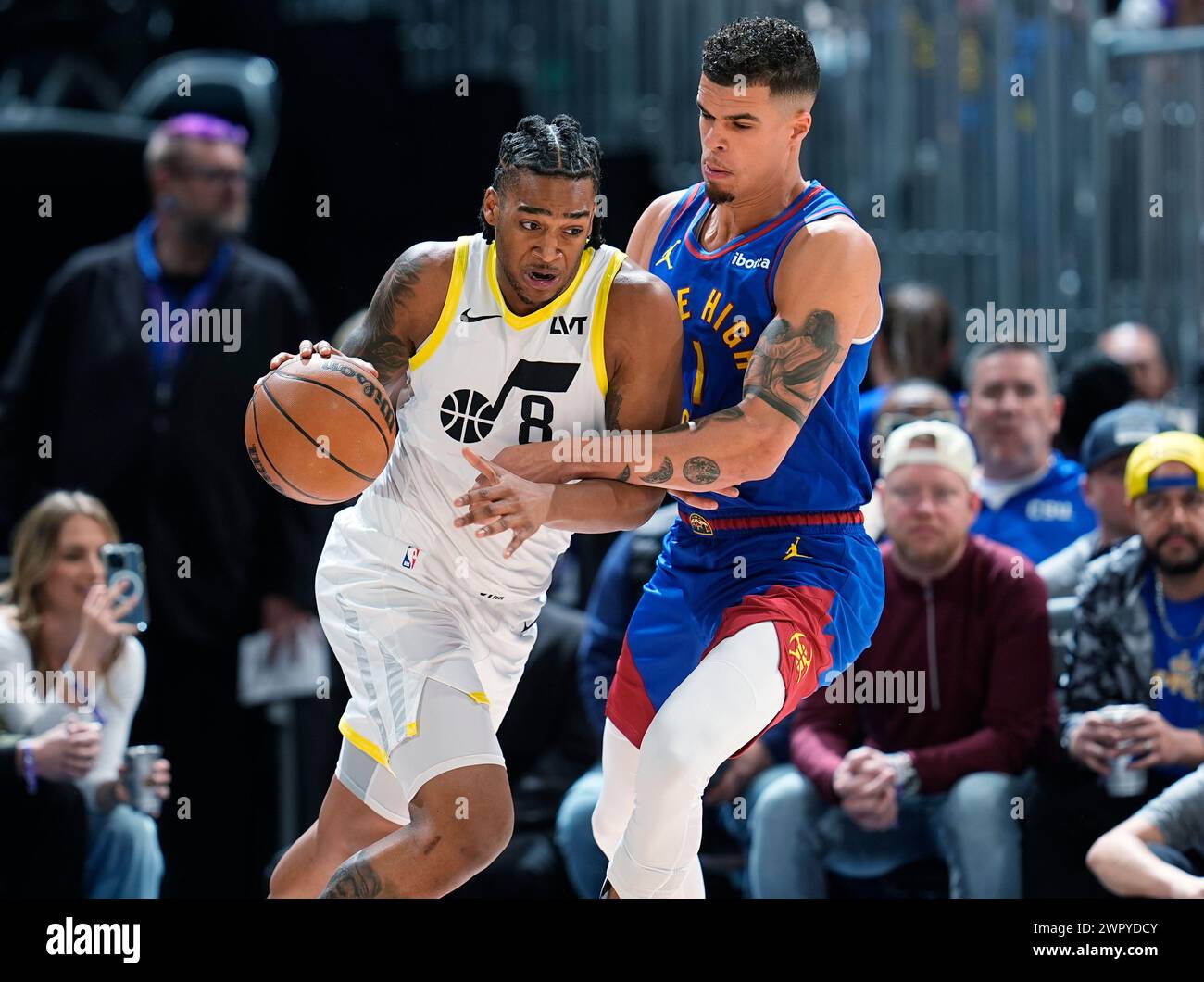 Utah Jazz forward Brice Sensabaugh, left, drives to the basket as ...