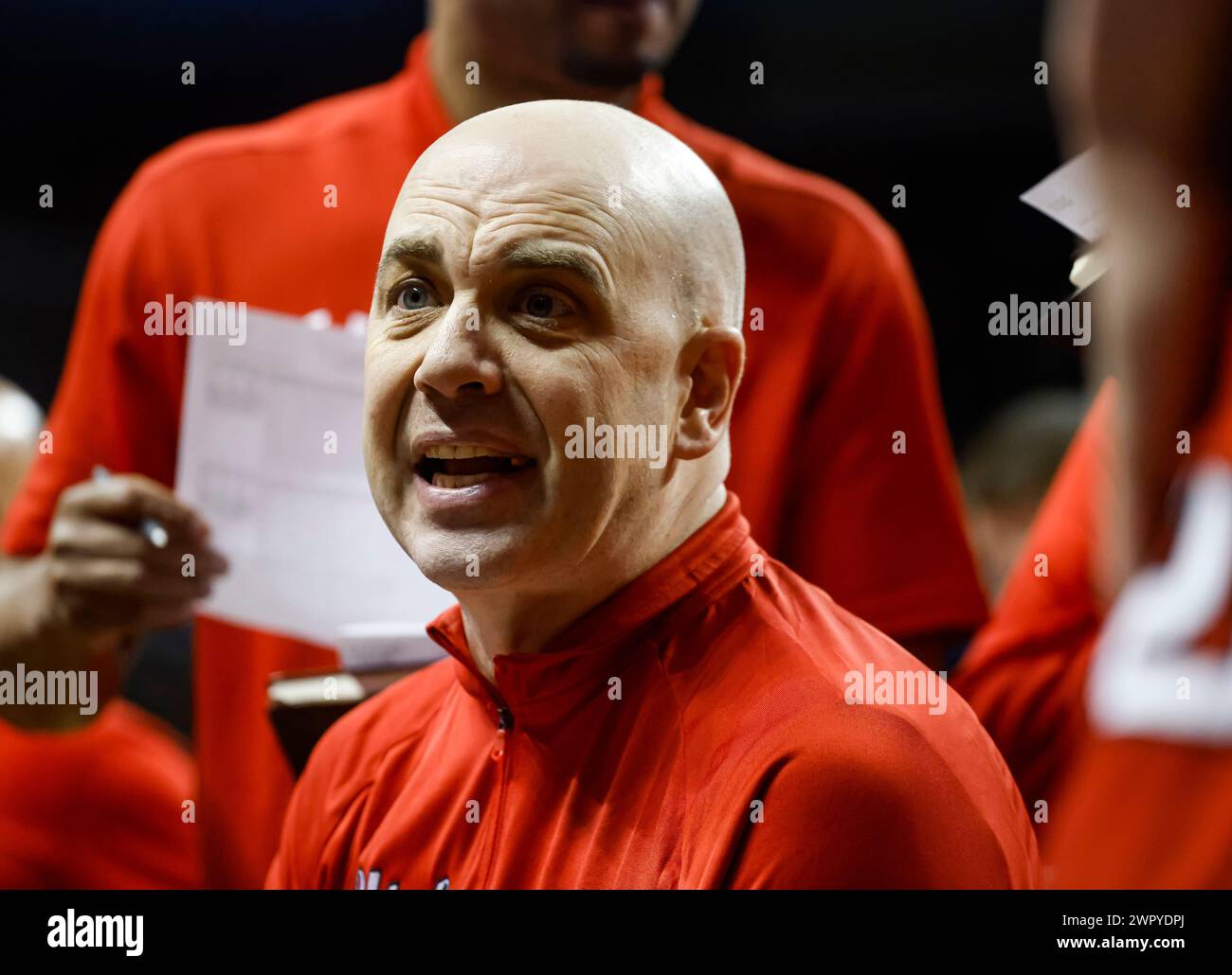Utah head coach Craig Smith talks to his team during a timeout in the ...