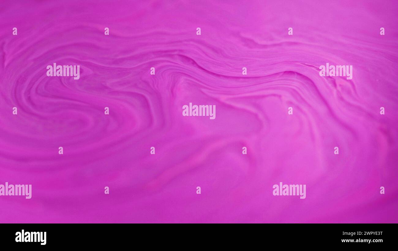 Pigment water mix liquid ornament pink ink waves Stock Photo - Alamy