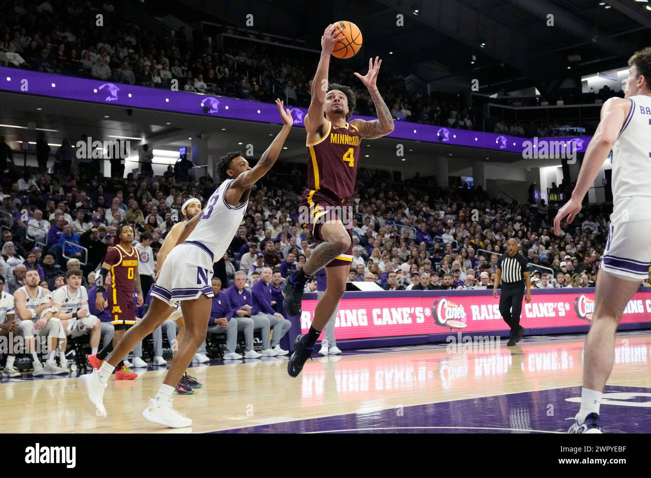 Minnesota guard Braeden Carrington (4) drives to the basket past Northwestern guard Blake Smith ...