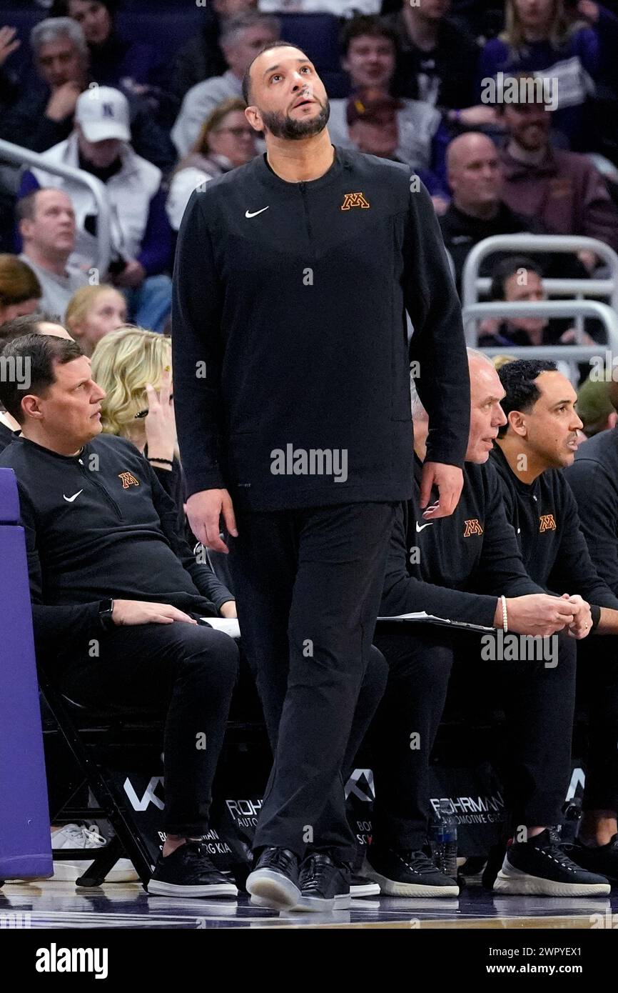 Minnesota head coach Ben Johnson looks up the scoreboard during the ...