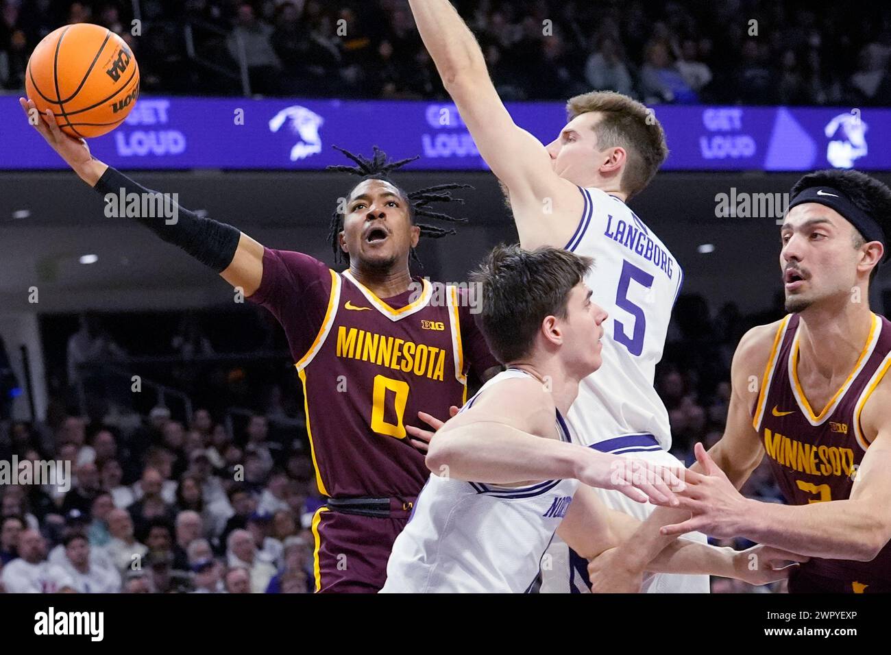 Minnesota guard Elijah Hawkins (0) drives to the basket against ...