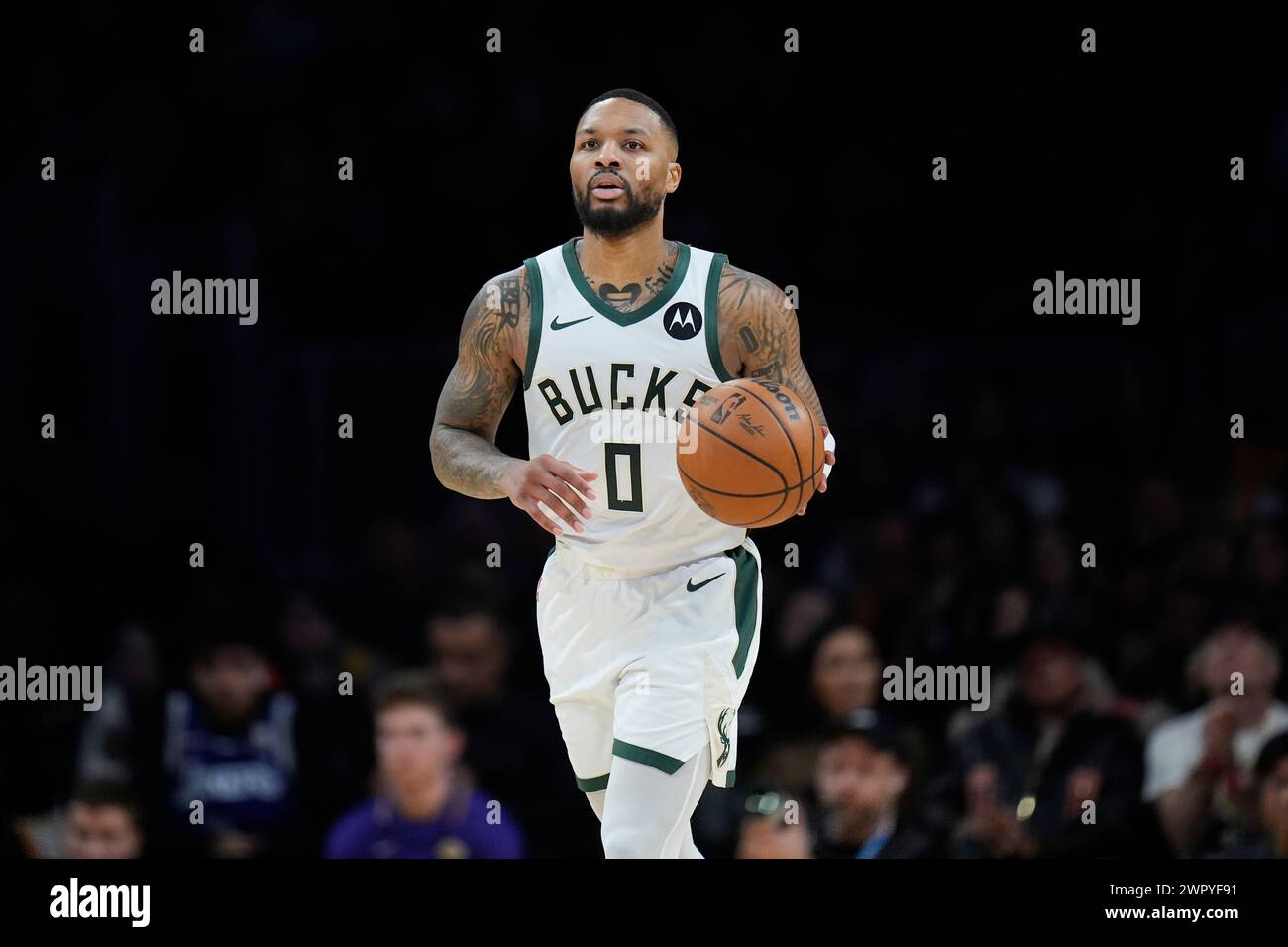 Milwaukee Bucks guard Damian Lillard (0) dribbles during the second ...