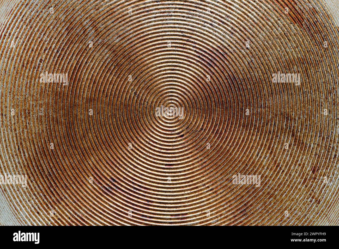 Close-up of the bottom of an old, burnt frying pan. Abstract concentric ...
