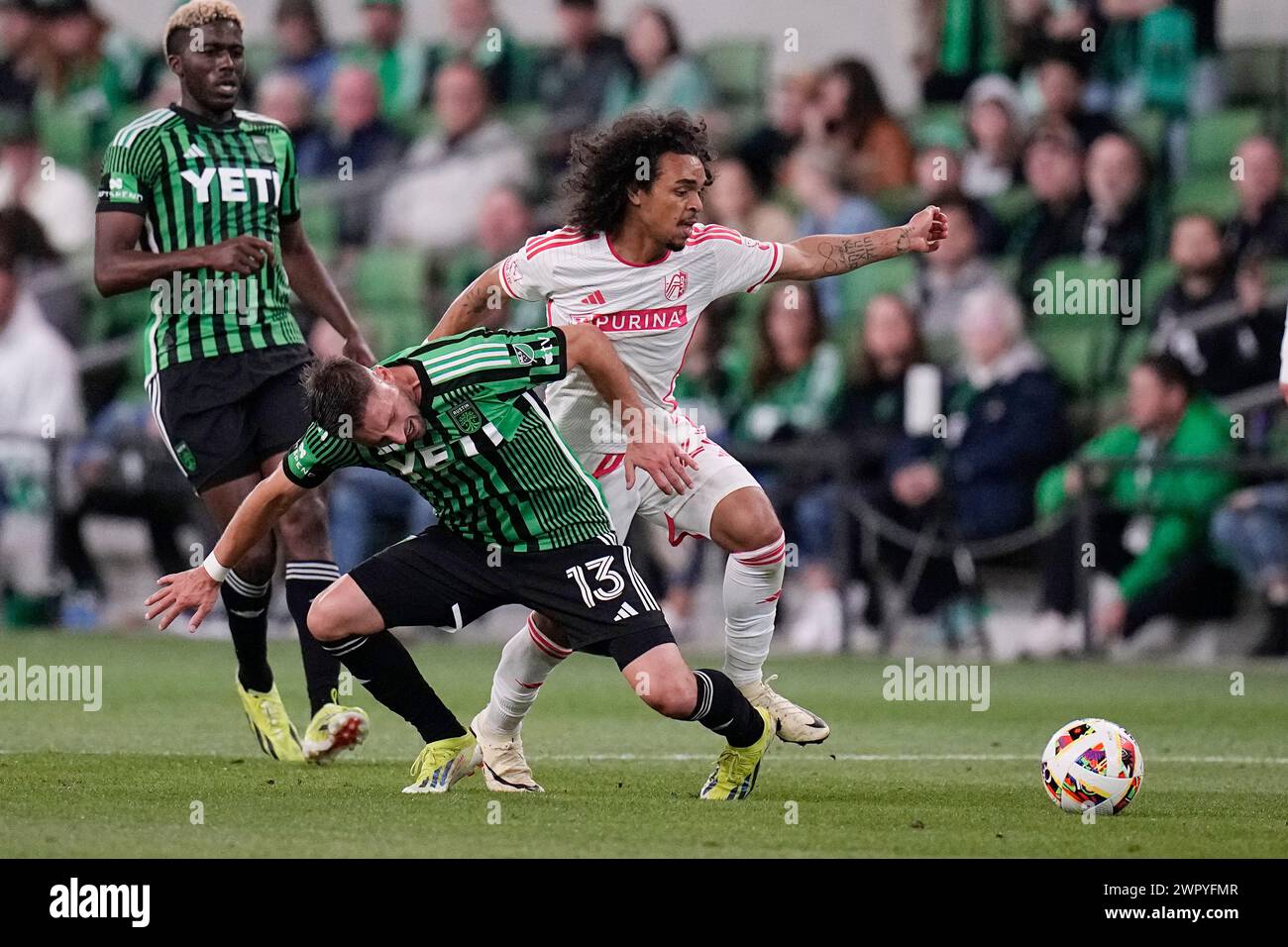 Austin FC midfielder Ethan Finlay (13) and St. Louis City midfielder ...
