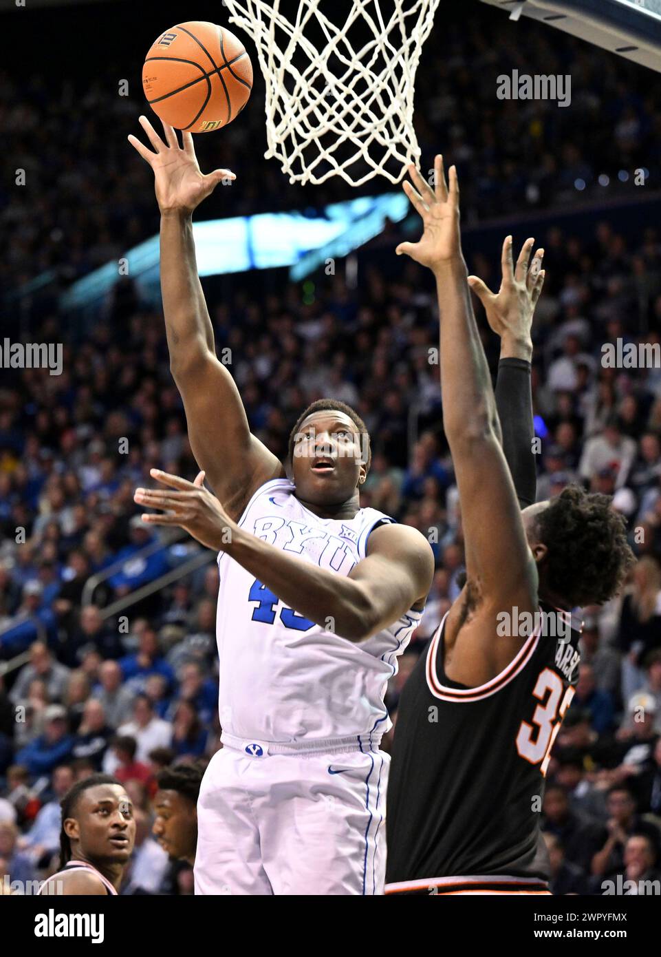 BYU forward Fousseyni Traore (45) pushes up a shot over Oklahoma State ...