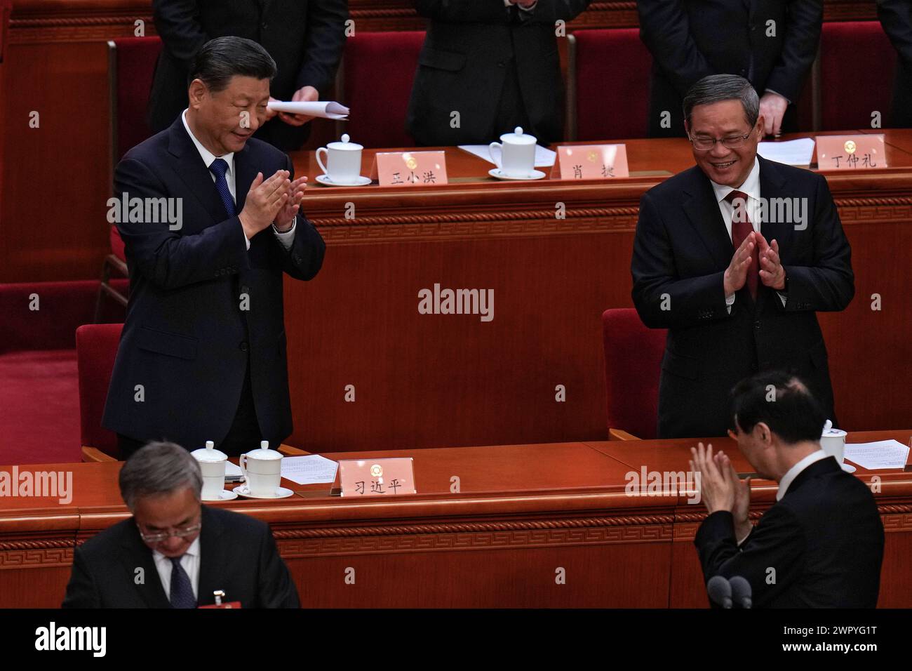 Chinese President Xi Jinping, left, and his Premier Li Qiang, right ...