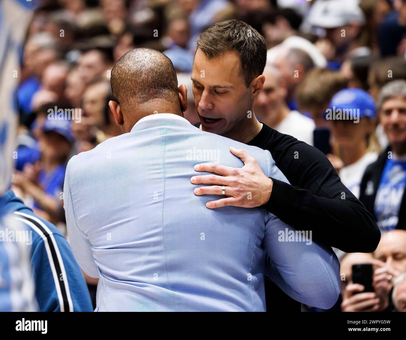 Duke head coach Jon Scheyer, right, speaks with North Carolina head ...