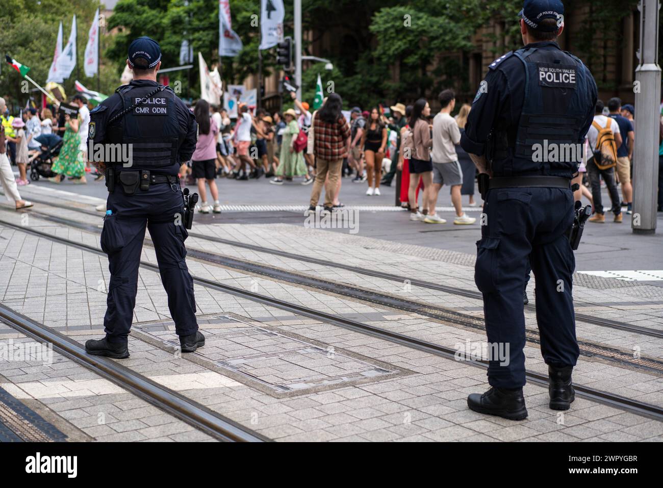 Police monitor demonstrators during a Sydney march supporting ...