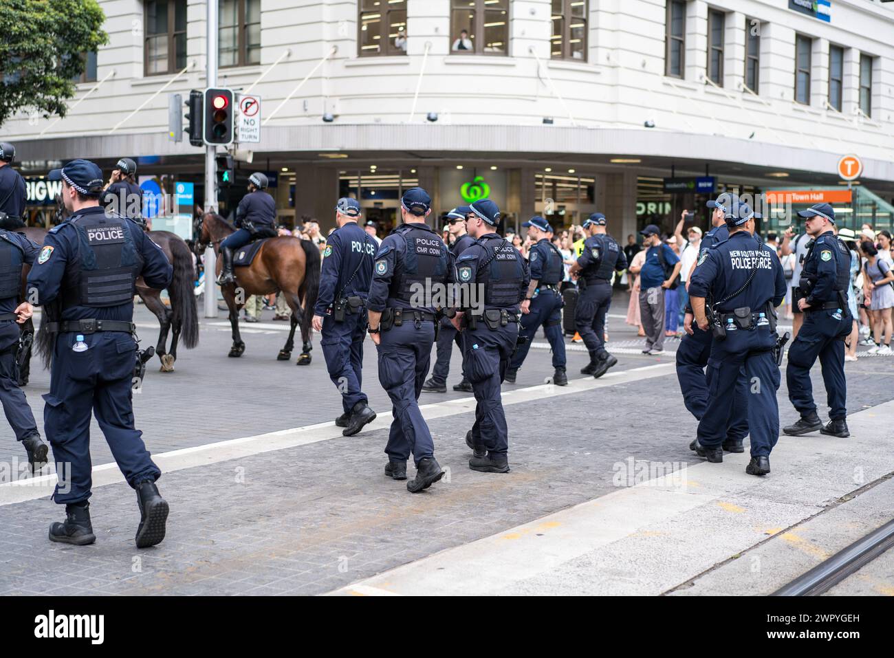 Police monitor demonstrators during a Sydney march supporting ...