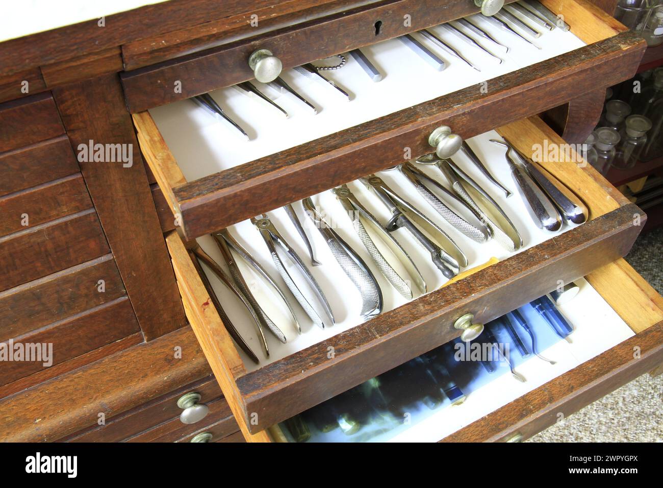 A historic dental cabinet with a display of instruments Stock Photo - Alamy
