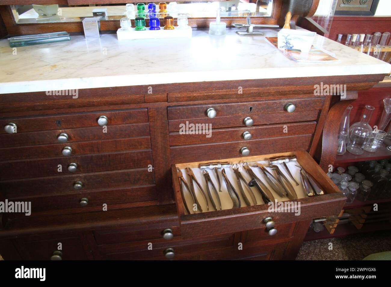A historic dental cabinet with a display of instruments Stock Photo - Alamy