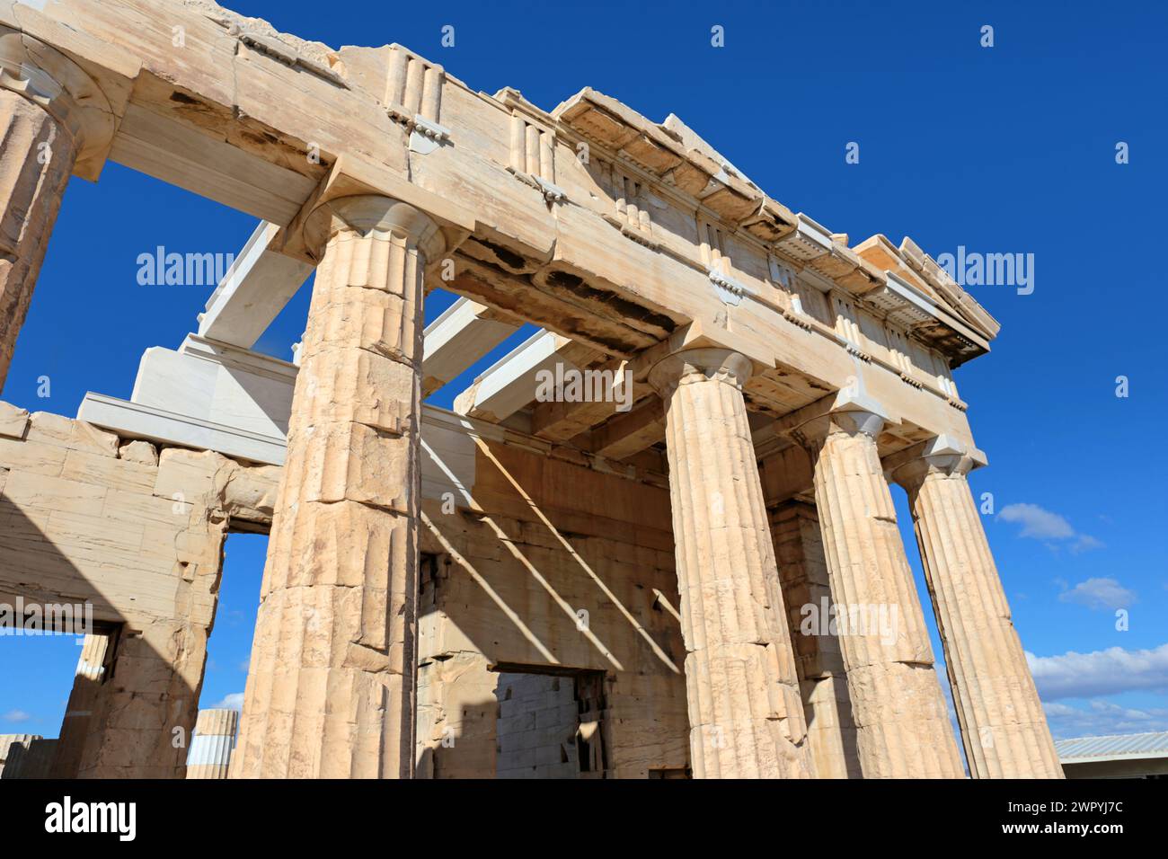 Up view to The Propylaea columns, the monumental gateway that serves as the entrance to the ...