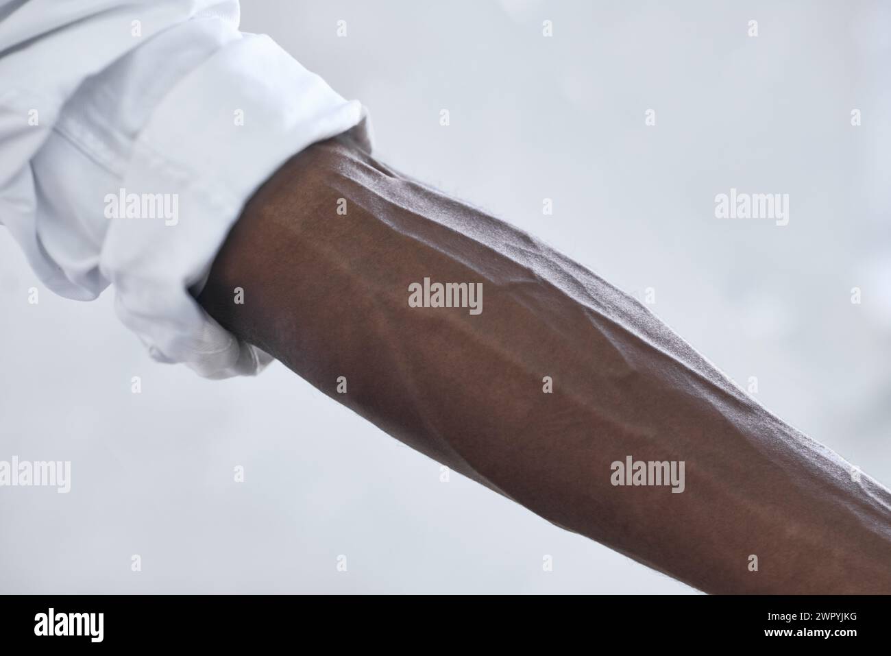 Strong, person and vein from muscle in arm with shirt, fashion and ...