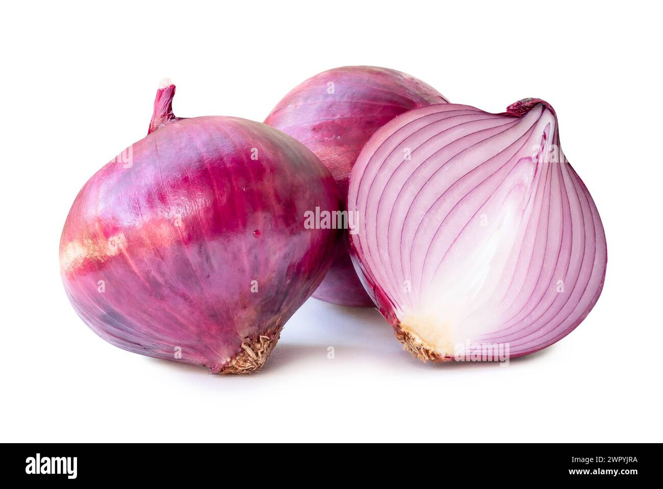 Front view of red or purple onion bulb with half in stack is isolated ...