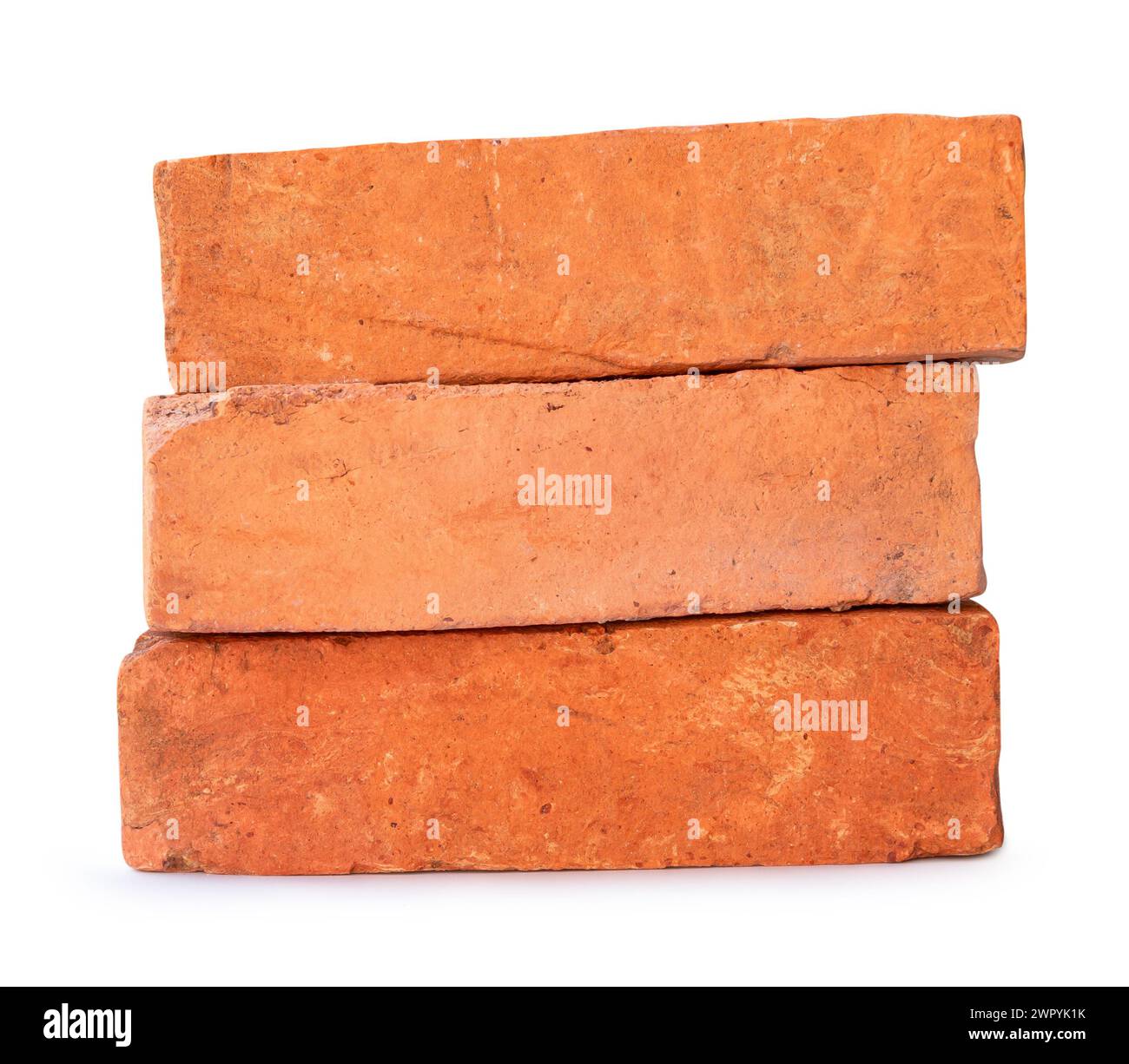 Side view of old red or orange bricks in stack is isolated on white ...