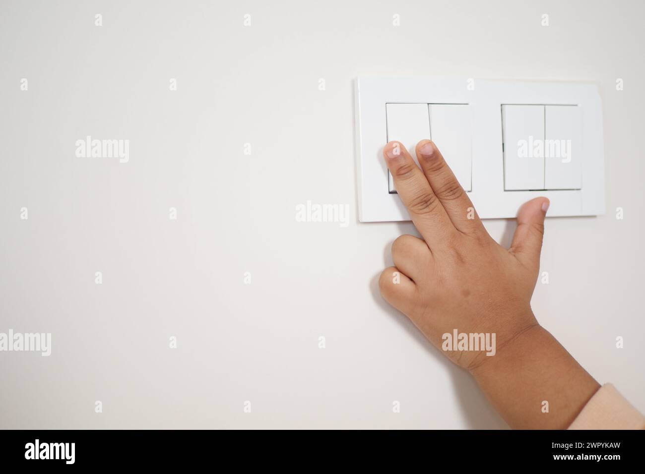 Child turning off light switch hi-res stock photography and images - Alamy