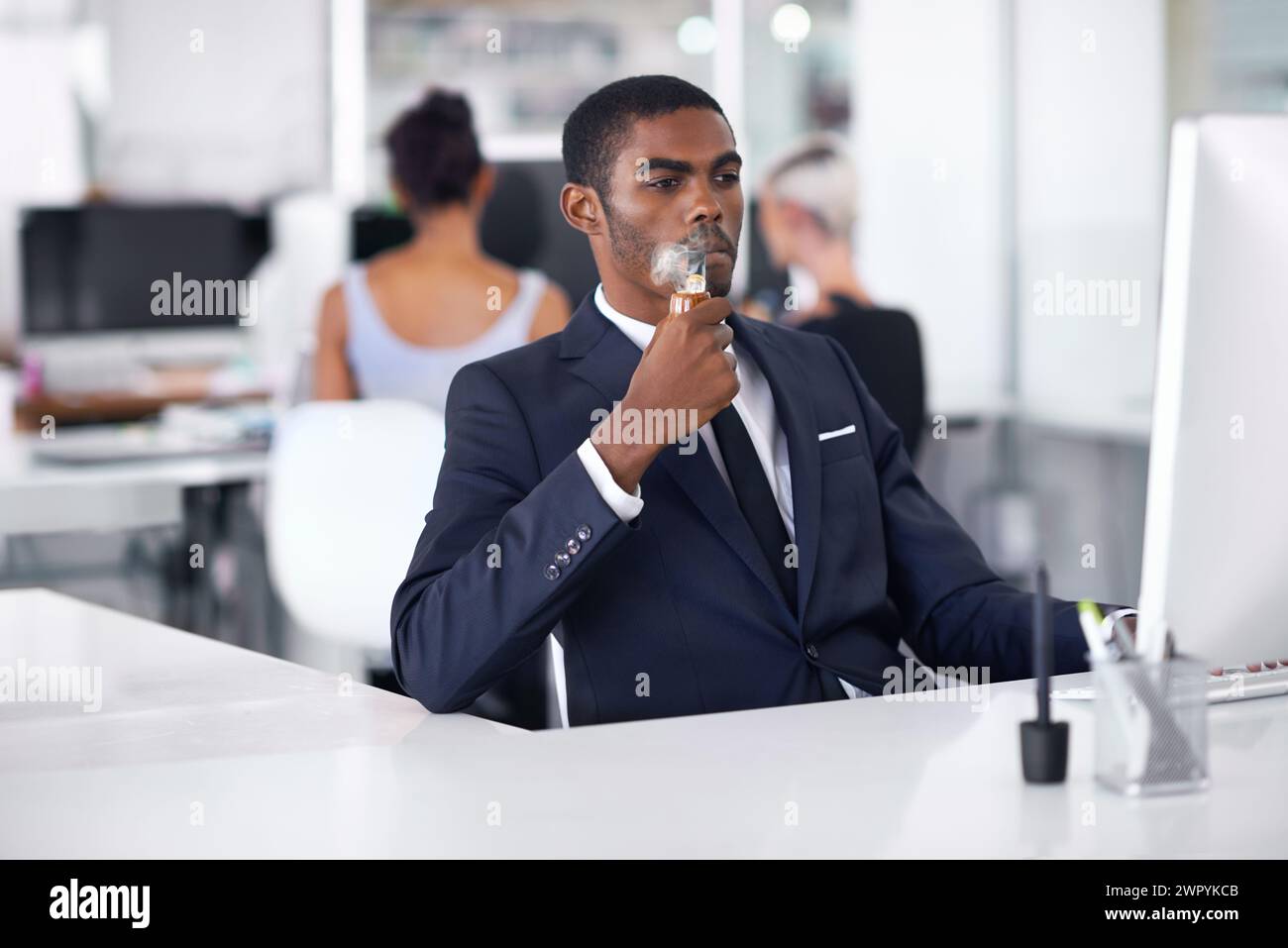 Black man vaping workplace hi-res stock photography and images - Alamy