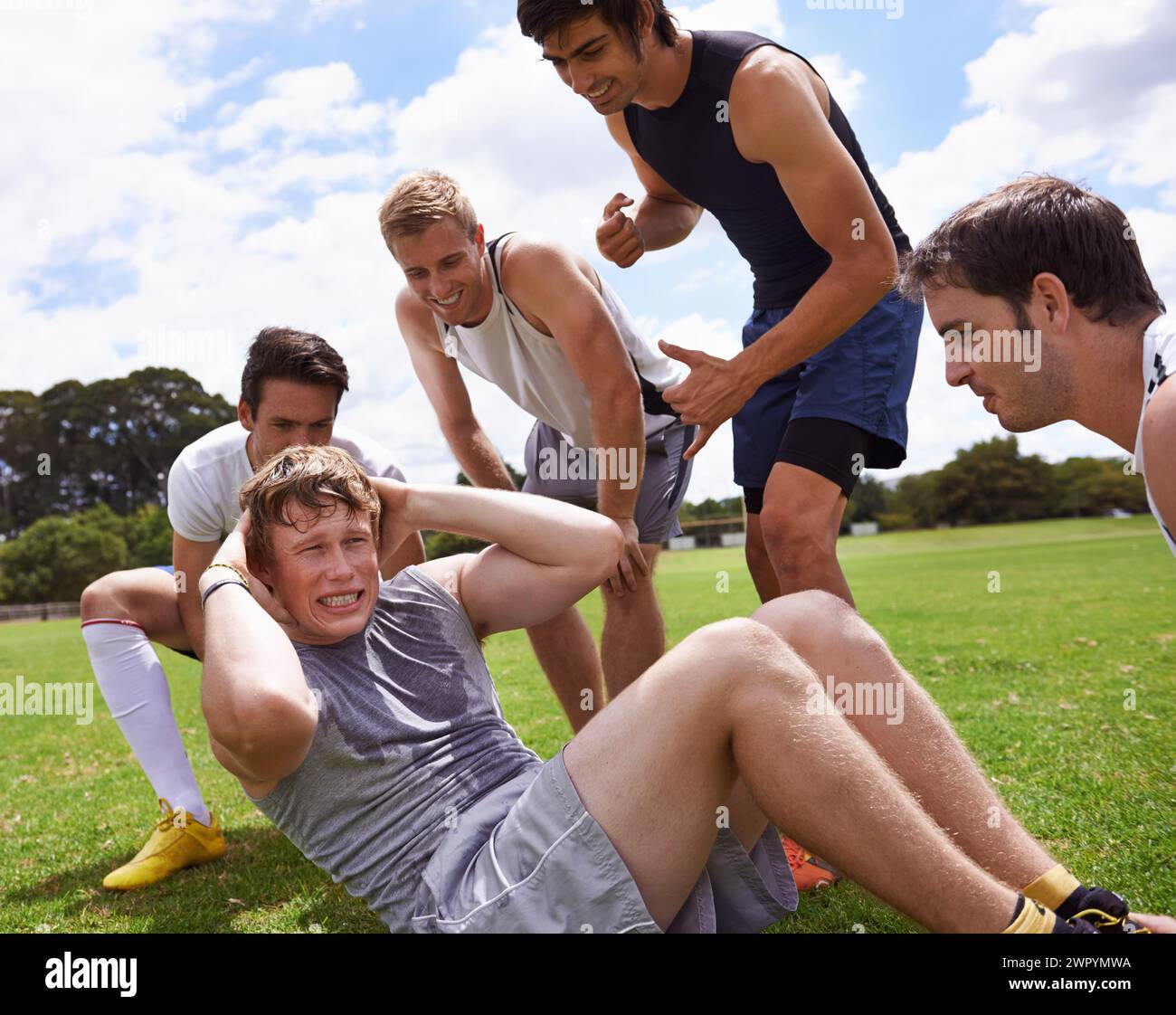 Man, sit ups for workout and cheers from team with support and coaching ...