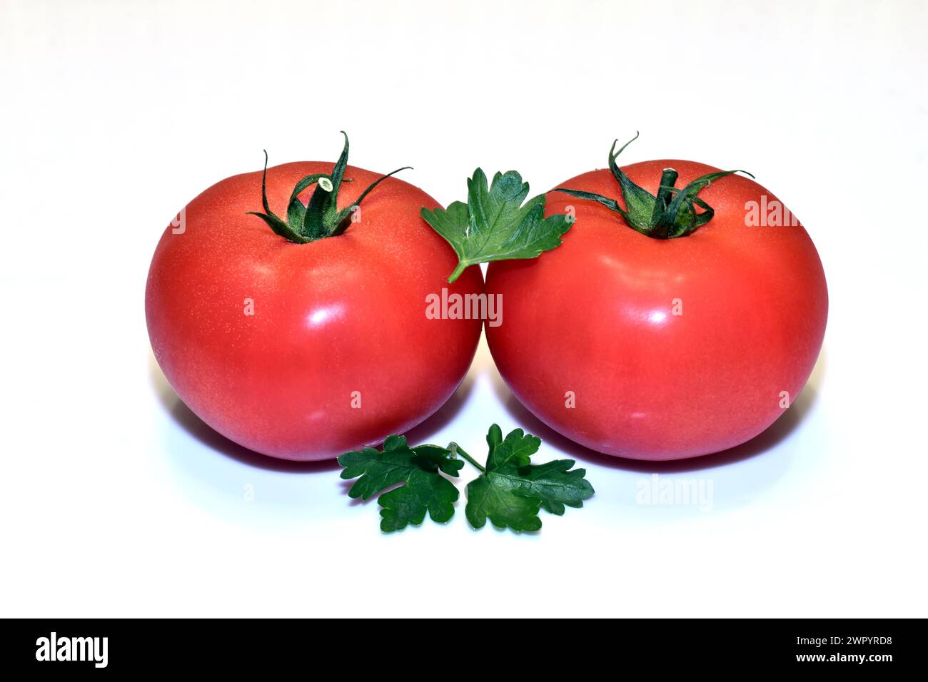 Two half cut tomato tomatoes hi-res stock photography and images - Alamy