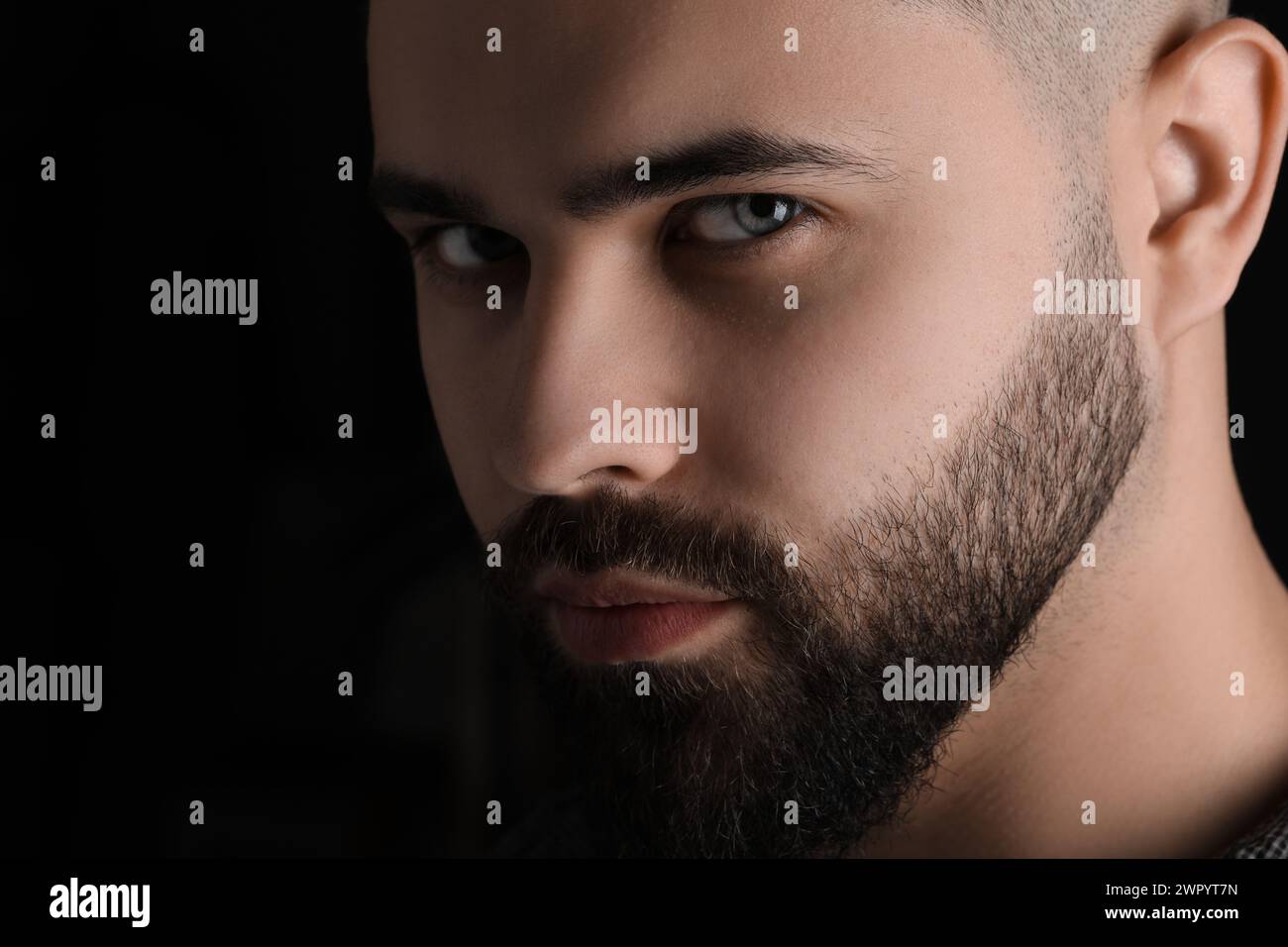 Evil eye. Man with scary eyes on black background Stock Photo - Alamy