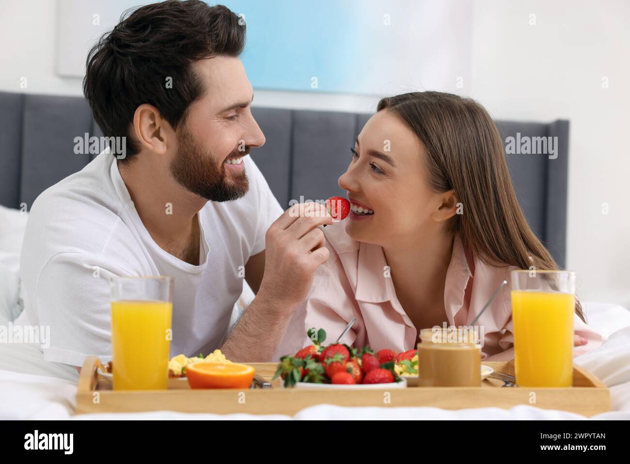 Woman feeding husband strawberry hi-res stock photography and images - Alamy