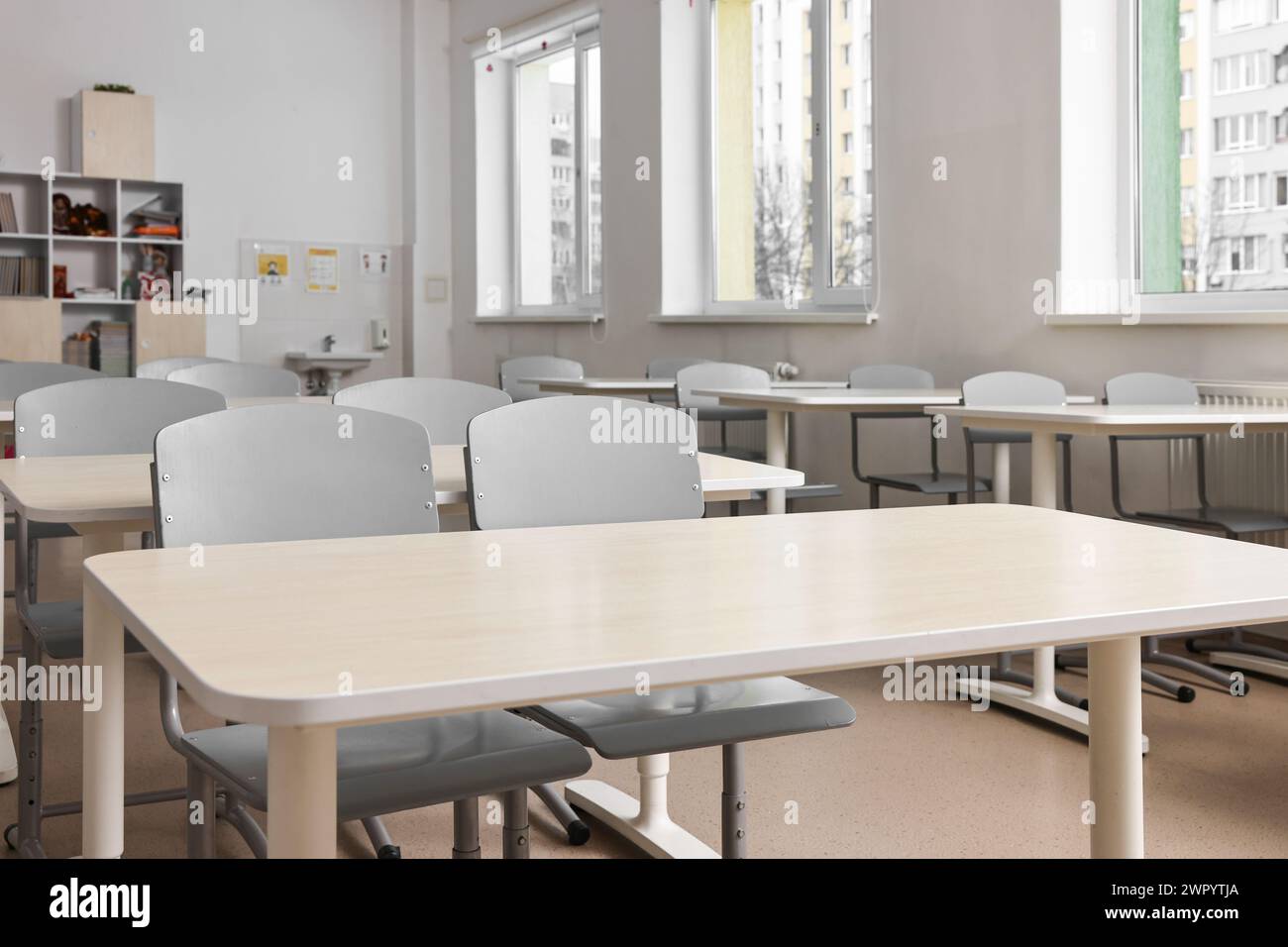 Empty school classroom with contemporary furniture and windows Stock ...