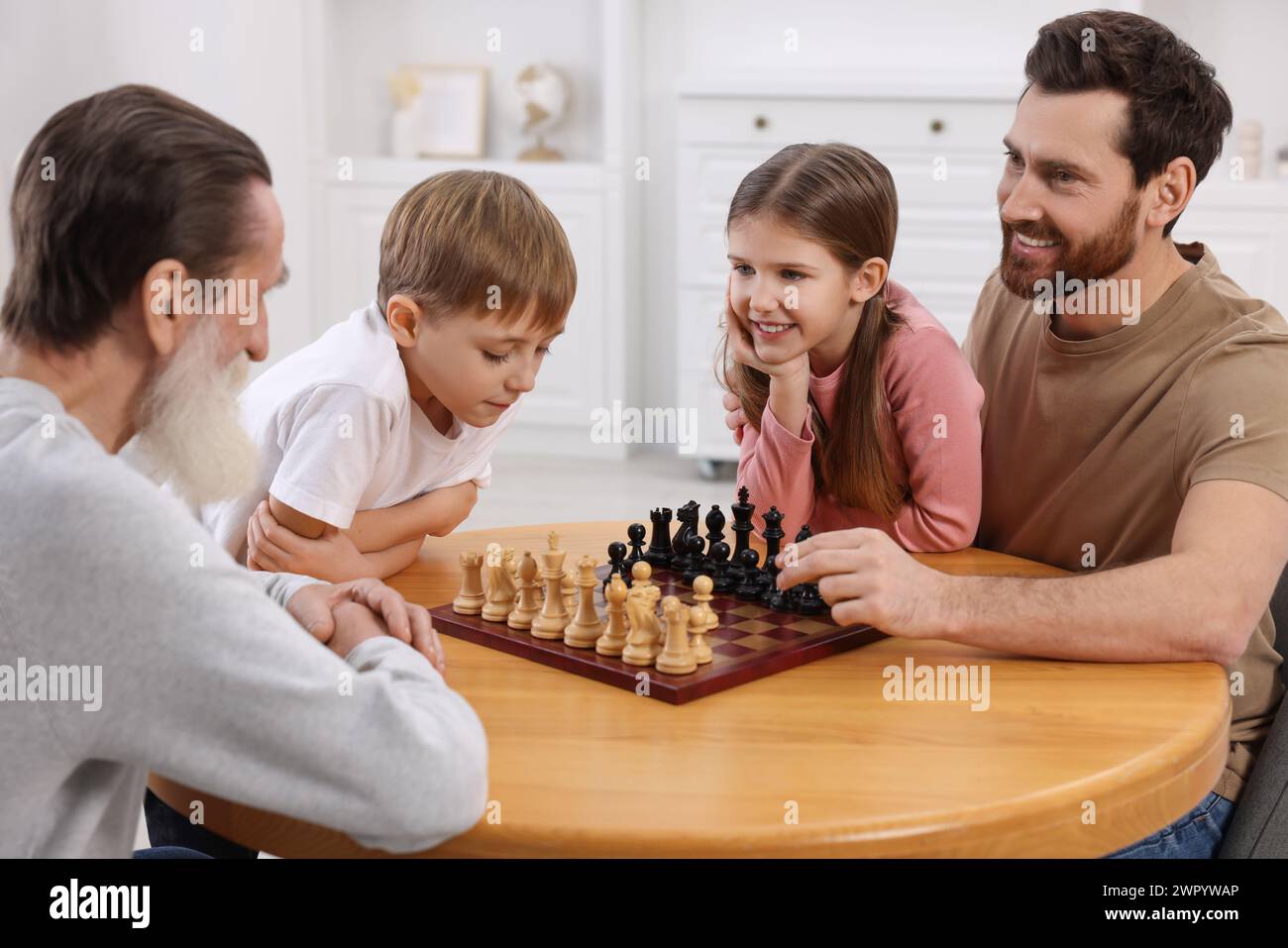 Father daughter playing chess in hi-res stock photography and images ...