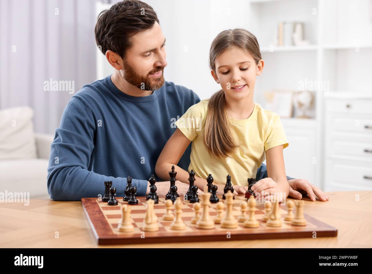 Father daughter playing chess home hi-res stock photography and images ...