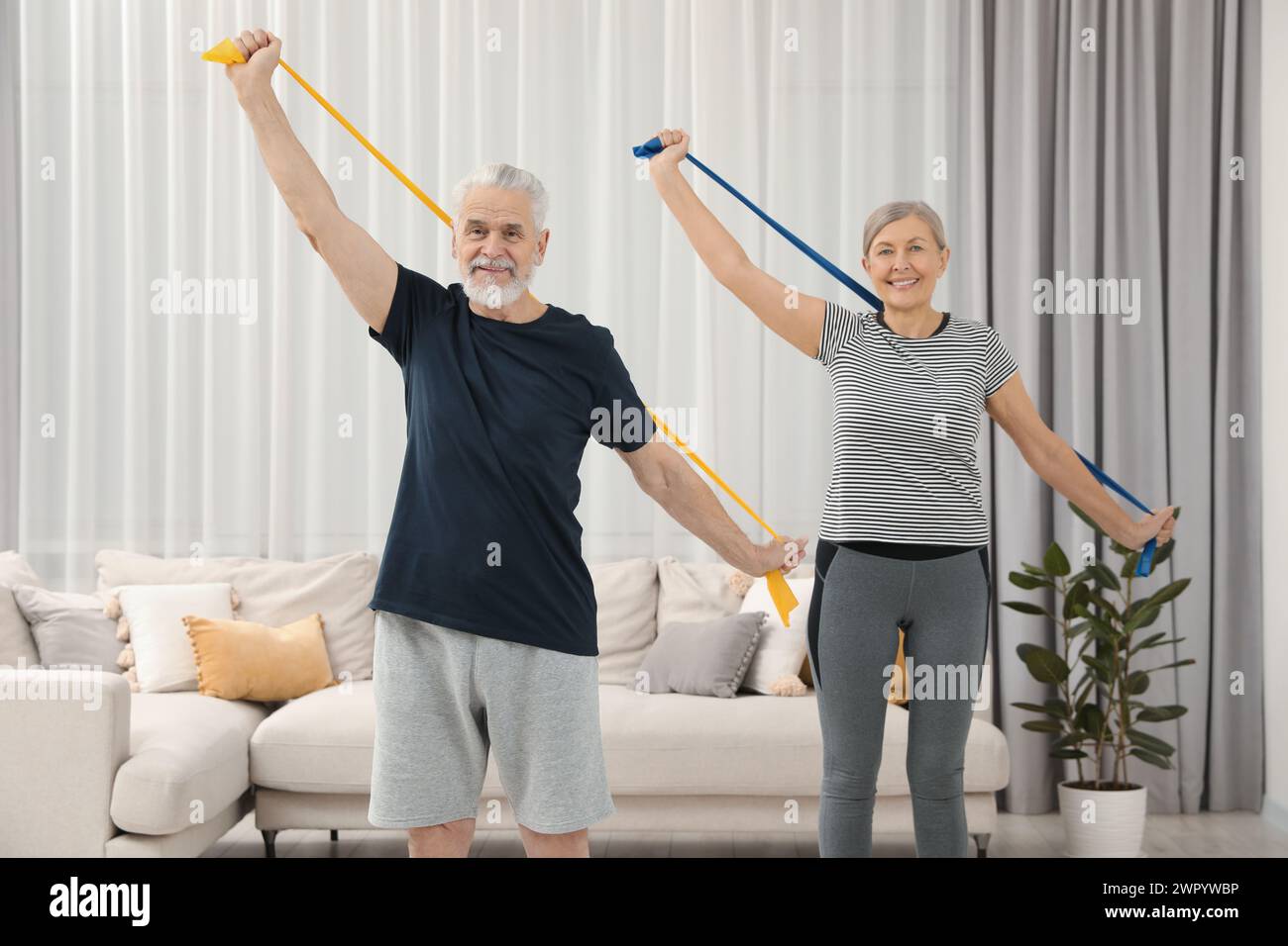 Couple doing stretching exercising home hi-res stock photography and ...