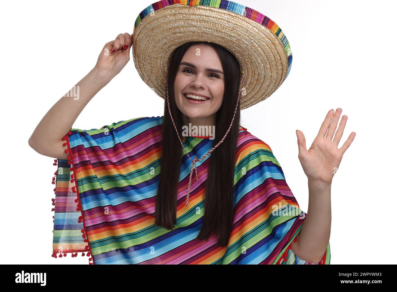 Young woman in Mexican sombrero hat and poncho waving hello on white ...