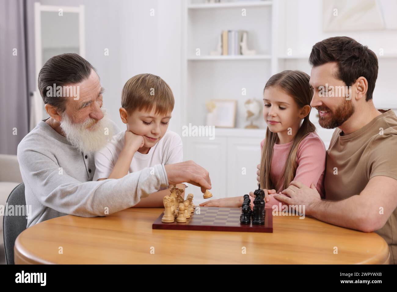 Father daughter playing chess in hi-res stock photography and images ...