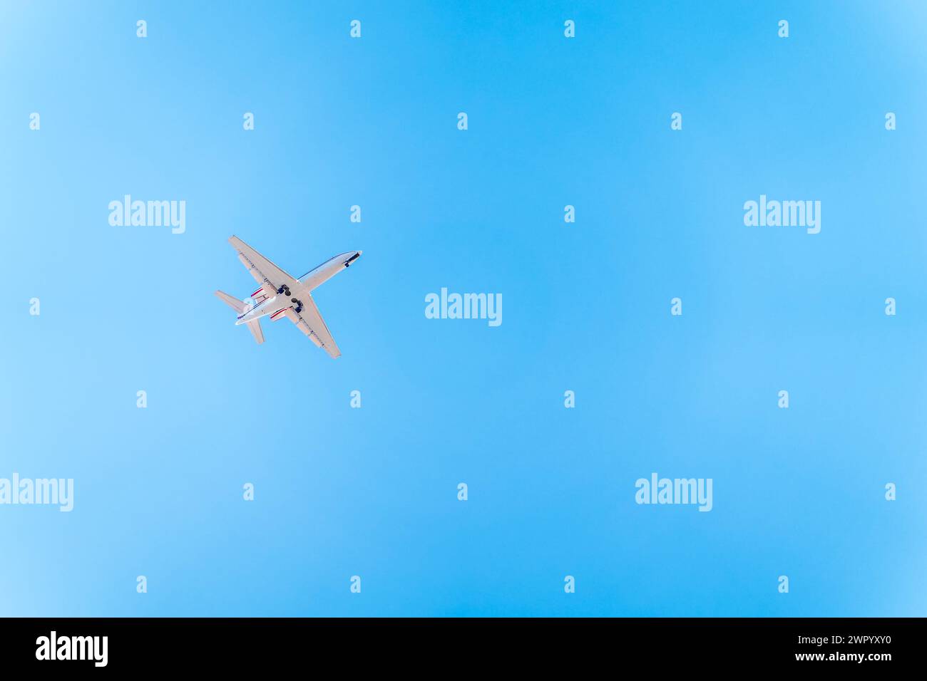 Airplane Cessna 680 before landing in blue sky. Airplane type Cessna ...