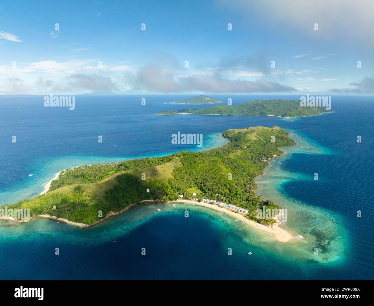 Islands surrounded by blue sea. Blue sky and clouds. Romblon, Romblon ...