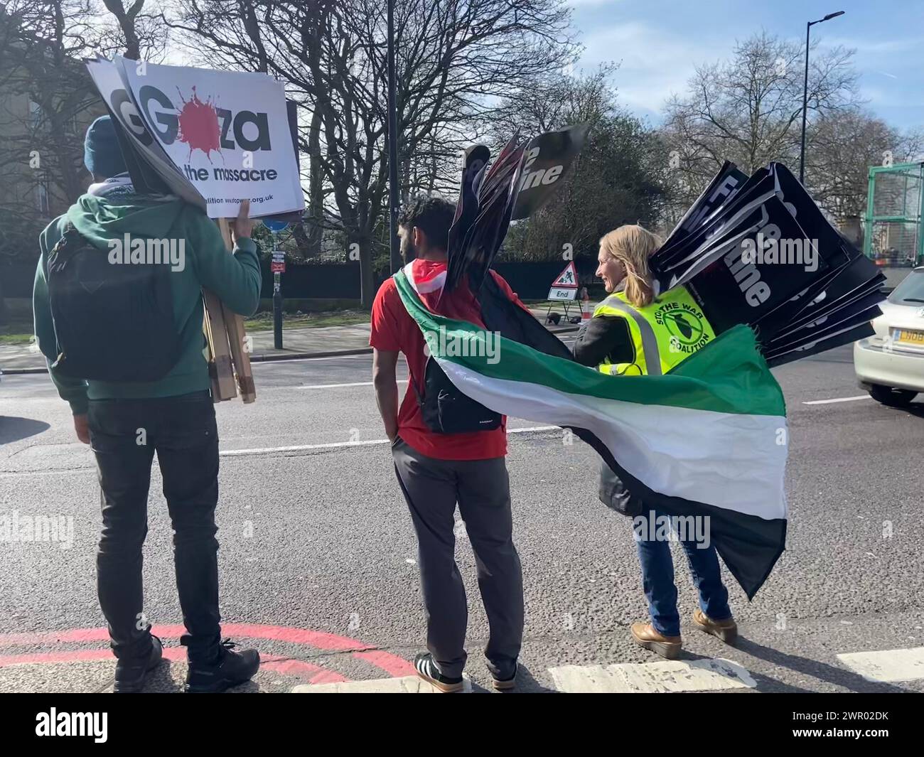 marchers with slogans and palestinian flags at the stop the war in gaza ...
