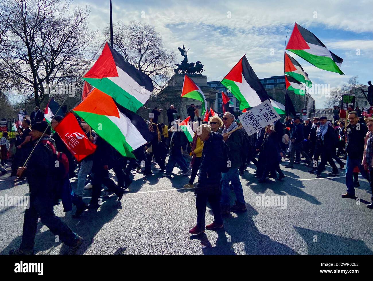 marchers with slogans and palestinian flags at the stop the war in gaza ...
