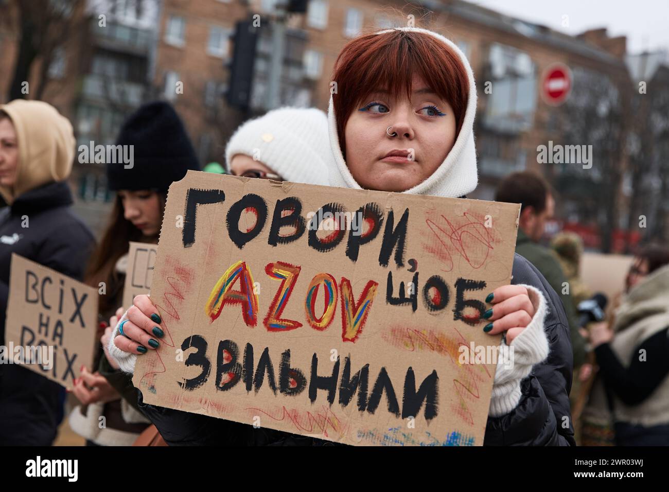 Ukrainian female holds a banner "Speak For Free Azov" on a peaceful ...