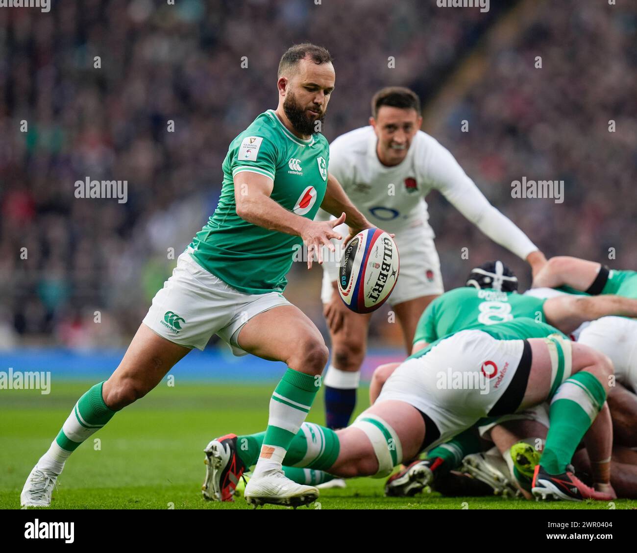Jamison Gibson-Park of Ireland sets to kick from a ruck during the 2024 Guinness 6 Nations match ...